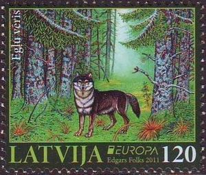 Stamp: Europa - Wolf (Canis lupus) at Clearing in the Spruce Forest ...