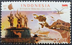 Stamp: Monument with soldiers and map of west papua (Indonesia(50th ...