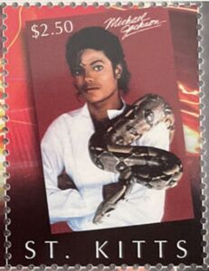 Stamp: Michael Jackson holding a snake (Saint Kitts(Michael Jackson in ...
